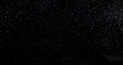 Glowing dust particles on black screen o... | Stock Video | Pond5