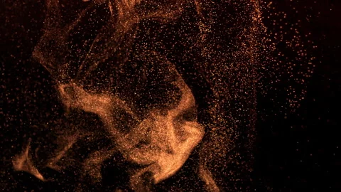 Glowing golden dust particles on alpha b... | Stock Video | Pond5