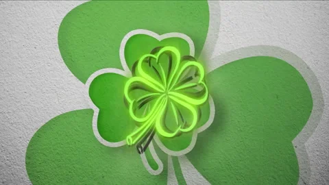 Glowing green shamrock animation over te... | Stock Video | Pond5