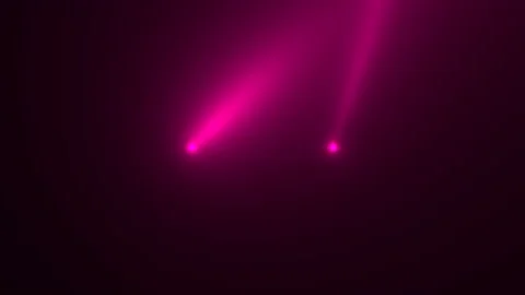 Glowing pink spotlight beams on stage | Stock Video | Pond5