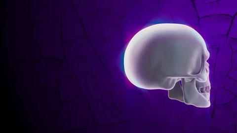 Glowing skull rotating on purple backgro... | Stock Video | Pond5