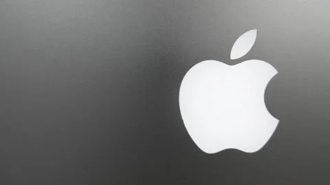 Glowing white Apple symbol logo on the l... | Stock Video | Pond5