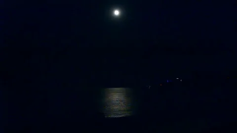 Glowing white moon and moon path on wate... | Stock Video | Pond5