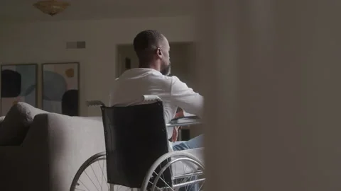 Glum Man Sits Looking Out Window In Whee... | Stock Video | Pond5