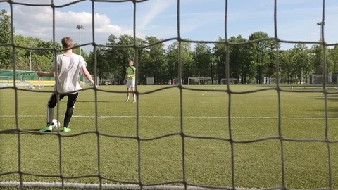 Goalkeeper Behind the Net of the Gate | Stock Video | Pond5