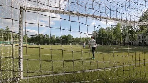 Goalkeeper Behind the Net of the Gate | Stock Video | Pond5