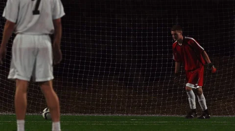 A goalkeeper kicks a soccer ball back in... | Stock Video | Pond5