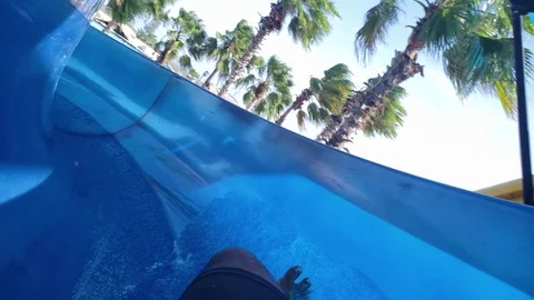 Going down the slip and slide at the wat... | Stock Video | Pond5
