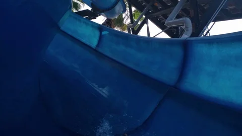 Going down the slip and slide at the wat... | Stock Video | Pond5