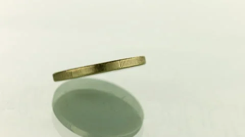 Gold coin spinning on white background | Stock Video | Pond5