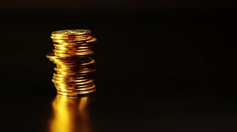 Gold coins on a black background. | Stock Video | Pond5