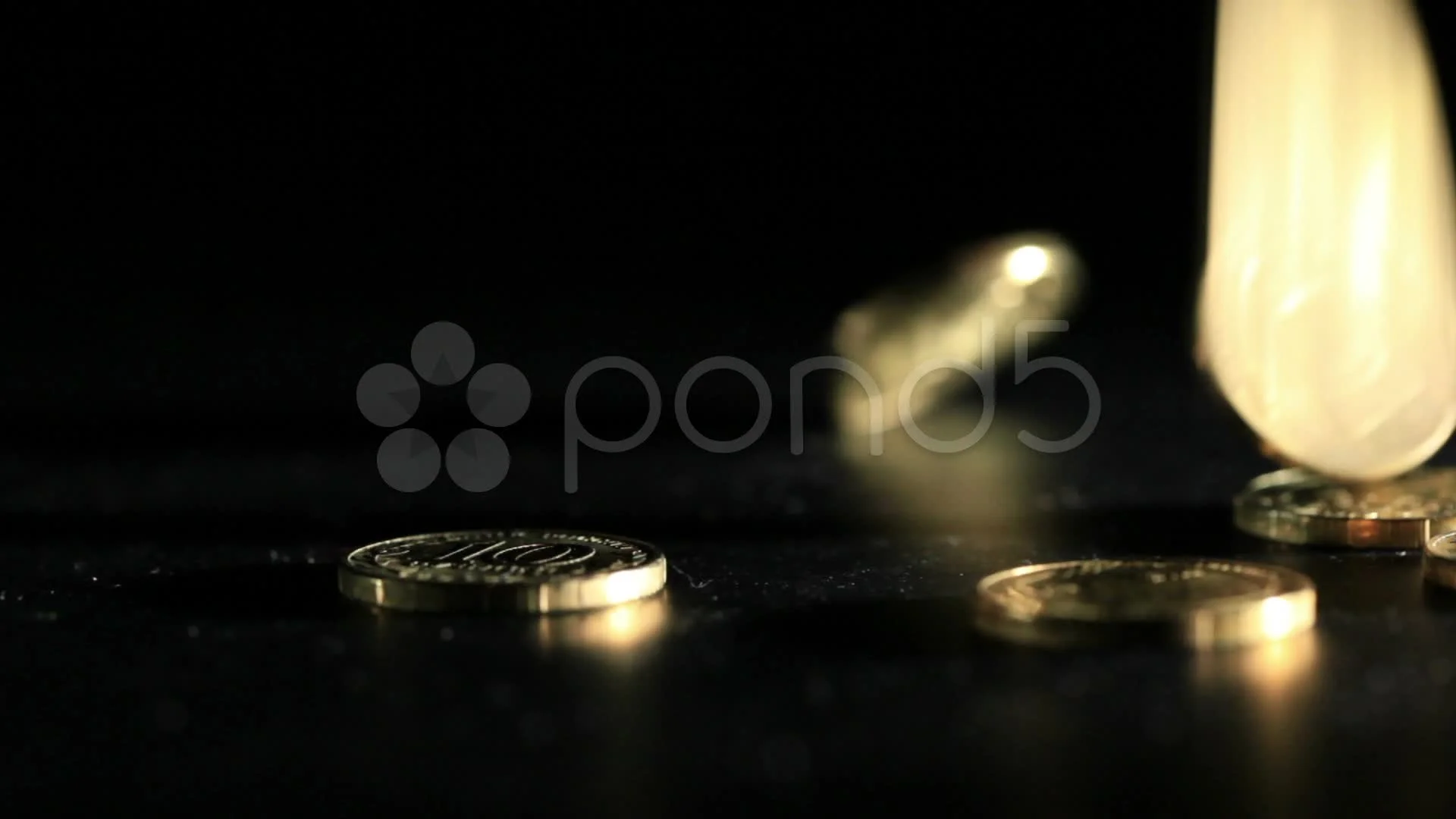 Gold Coins Falling From Hand