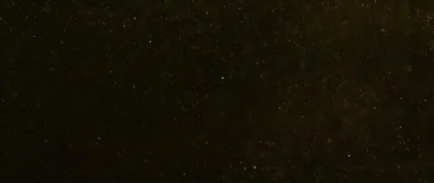 Gold dust particles floating in air | Stock Video | Pond5