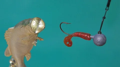 gold fish hook water background | Stock Video | Pond5