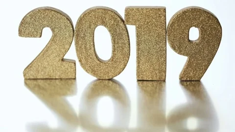 Gold numbers of 2019 year on a silver ba... | Stock Video | Pond5