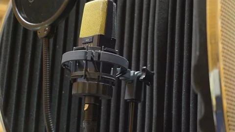 The golden and black color microphone in... | Stock Video | Pond5