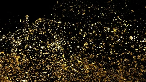 golden glitter particles explosion on bl... | Stock Video | Pond5