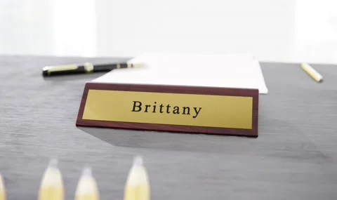 Golden Name Tag of Brittany on a CEO or ... | Stock Video | Pond5