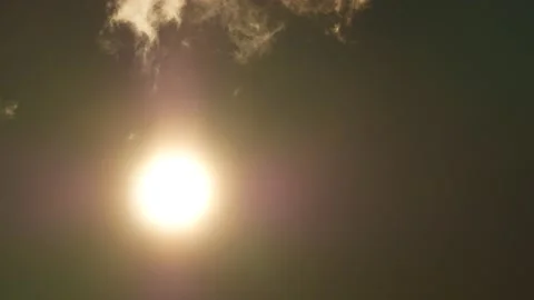 golden smoke clouds with sun at sunrise ... | Stock Video | Pond5