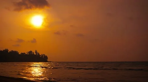 Golden Sun Rays over a Tropical Beach as... | Stock Video | Pond5