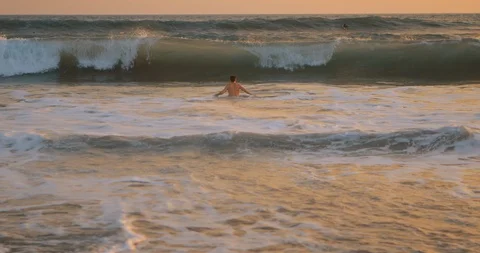 Golden sunset or sunrise on tropical bea... | Stock Video | Pond5