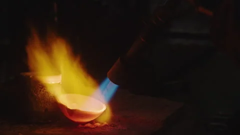 Goldsmith melting gold in crucible with ... | Stock Video | Pond5