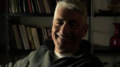 good-looking man in the dim light begins... | Stock Video | Pond5