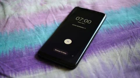 Good morning 7 am alarm clock on the pho... | Stock Video | Pond5