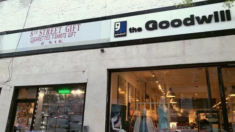 Goodwill sign front entrance panning acr... | Stock Video | Pond5