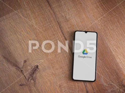 Google Drive app launch screen with logo on the display of a black ...