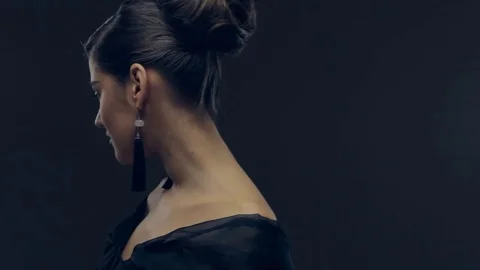 Gorgeous brunette woman turning head on ... | Stock Video | Pond5