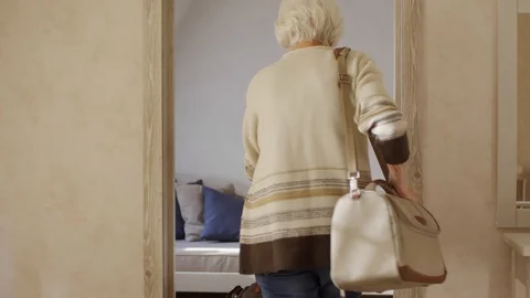 Gorgeous Elderly Lady Moving into Hotel ... | Stock Video | Pond5