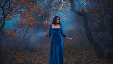 gothic woman walking in dark autumn fore... | Stock Video | Pond5