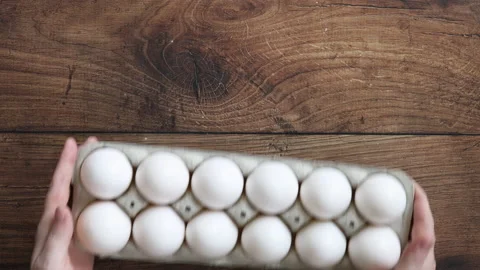 Grabbing an Egg out of an Egg Carton on ... | Stock Video | Pond5