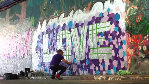 Graffiti Artist busy drawing in the Graf... | Stock Video | Pond5
