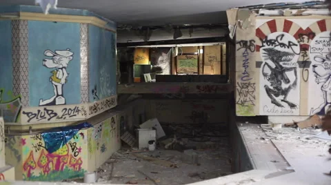 Graffiti inside abandoned pool building | Stock Video | Pond5