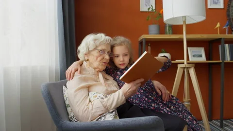 Grandma Reading Book with Granddaughter ... | Stock Video | Pond5