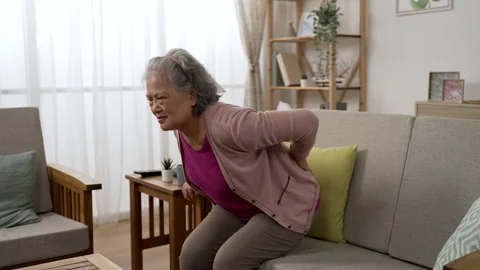 grandma suffering chronic backache | Stock Video | Pond5