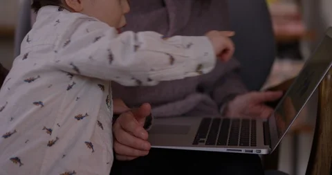 Grandson poking laptop computer screen i... | Stock Video | Pond5