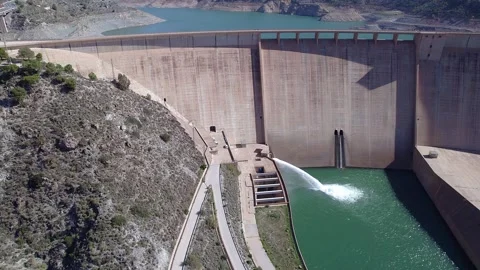 Gravity dam discharging water into the r... | Stock Video | Pond5