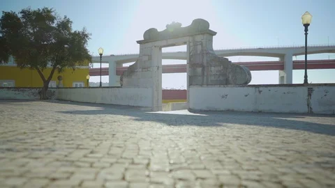Great stone gate at sunrise with bridge ... | Stock Video | Pond5