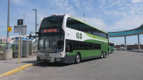 Green double decker bus at station. Pic... | Stock Video | Pond5