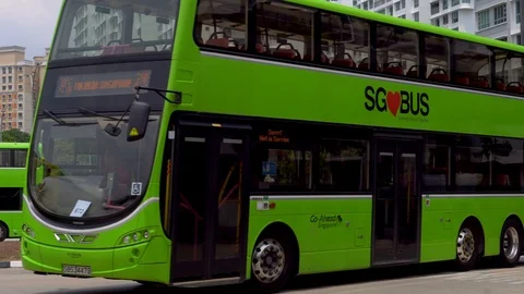 Green Double Decker Buses Arriving at De... | Stock Video | Pond5