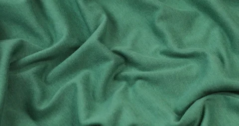 green fabric background. Green cloth wav... | Stock Video | Pond5