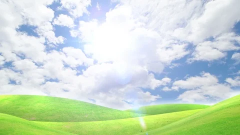 Green field with time lapse of clouds ba... | Stock Video | Pond5