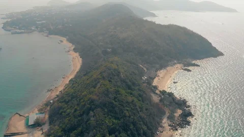 green forest on hilly island with sand b... | Stock Video | Pond5