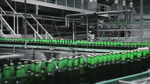 Green glass beer bottles moving on indus... | Stock Video | Pond5