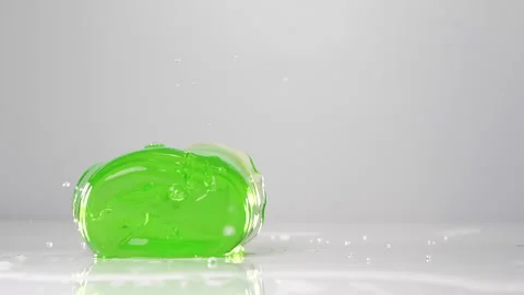 Green jelly falling down. Сlose up slow... | Stock Video | Pond5