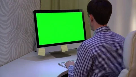 Green MonitorYoung man on his laptop PC ... | Stock Video | Pond5