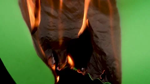 Green screen burning Black behind backgr... | Stock Video | Pond5